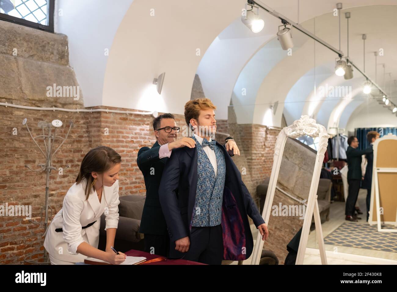 Putting on jacket hi-res stock photography and images - Alamy