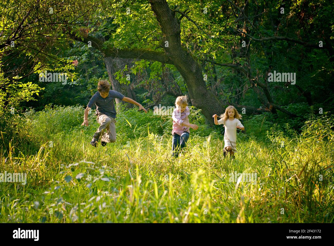 Kids running outdoors happy nature hi-res stock photography and images ...