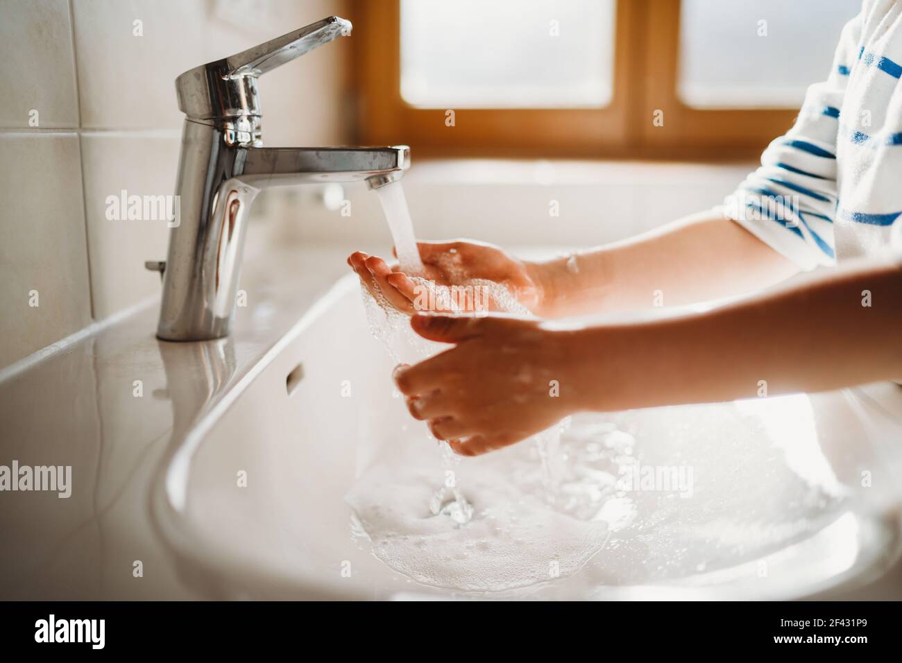Close up of young hands being washed with soap Stock Photo - Alamy