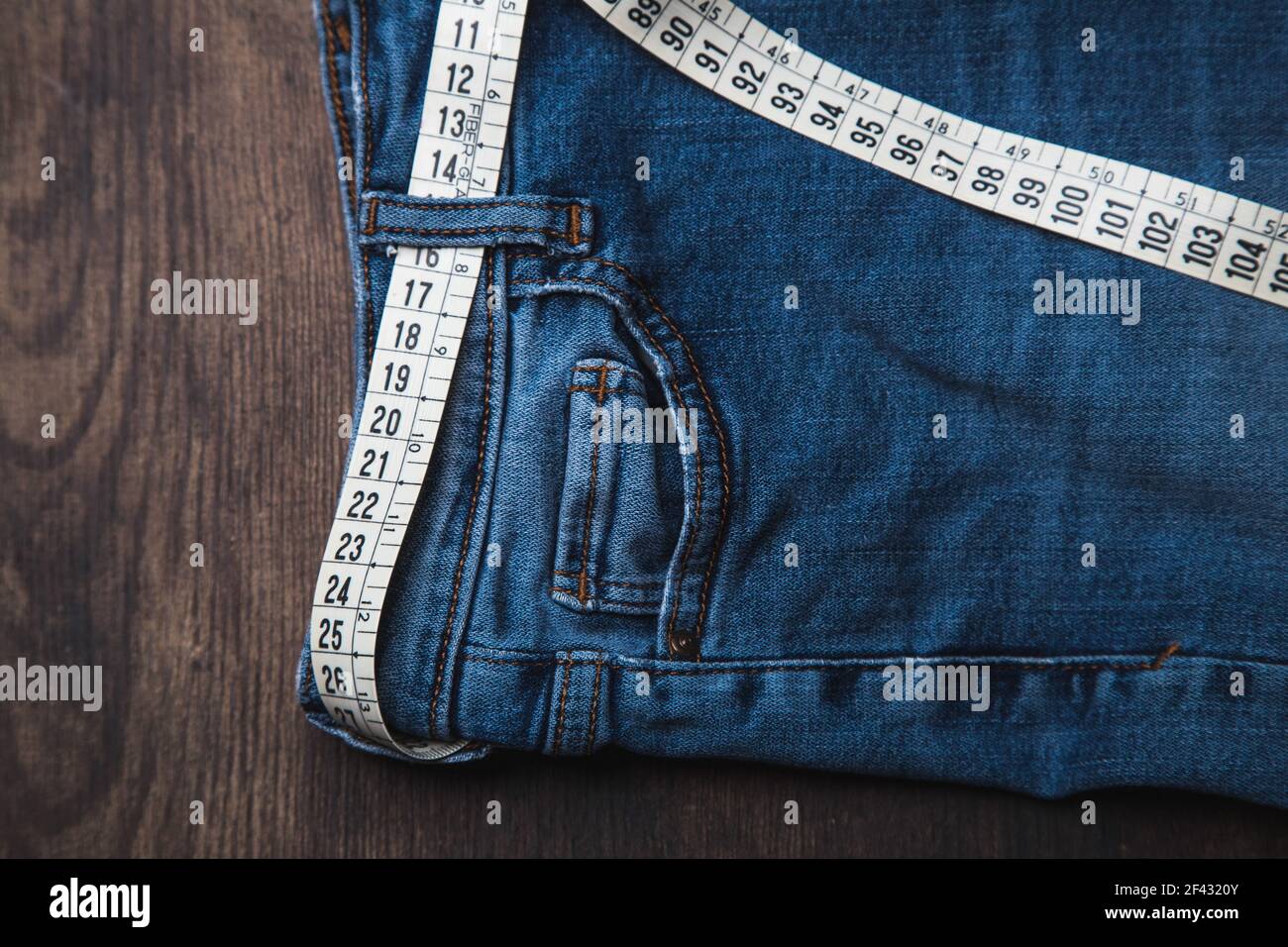 Blue jeans with meter size Stock Photo - Alamy