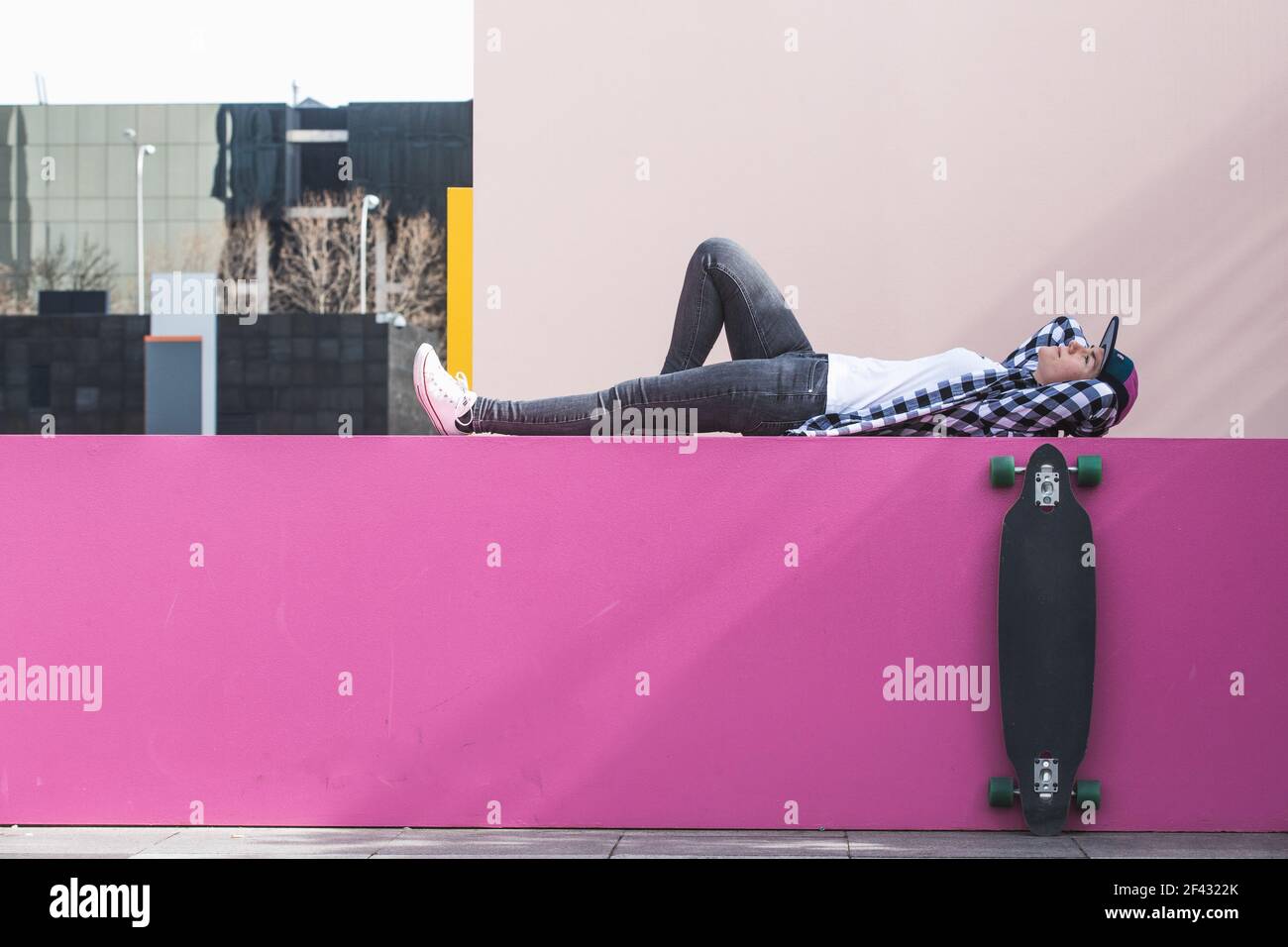 woman with cap lying down Stock Photo - Alamy