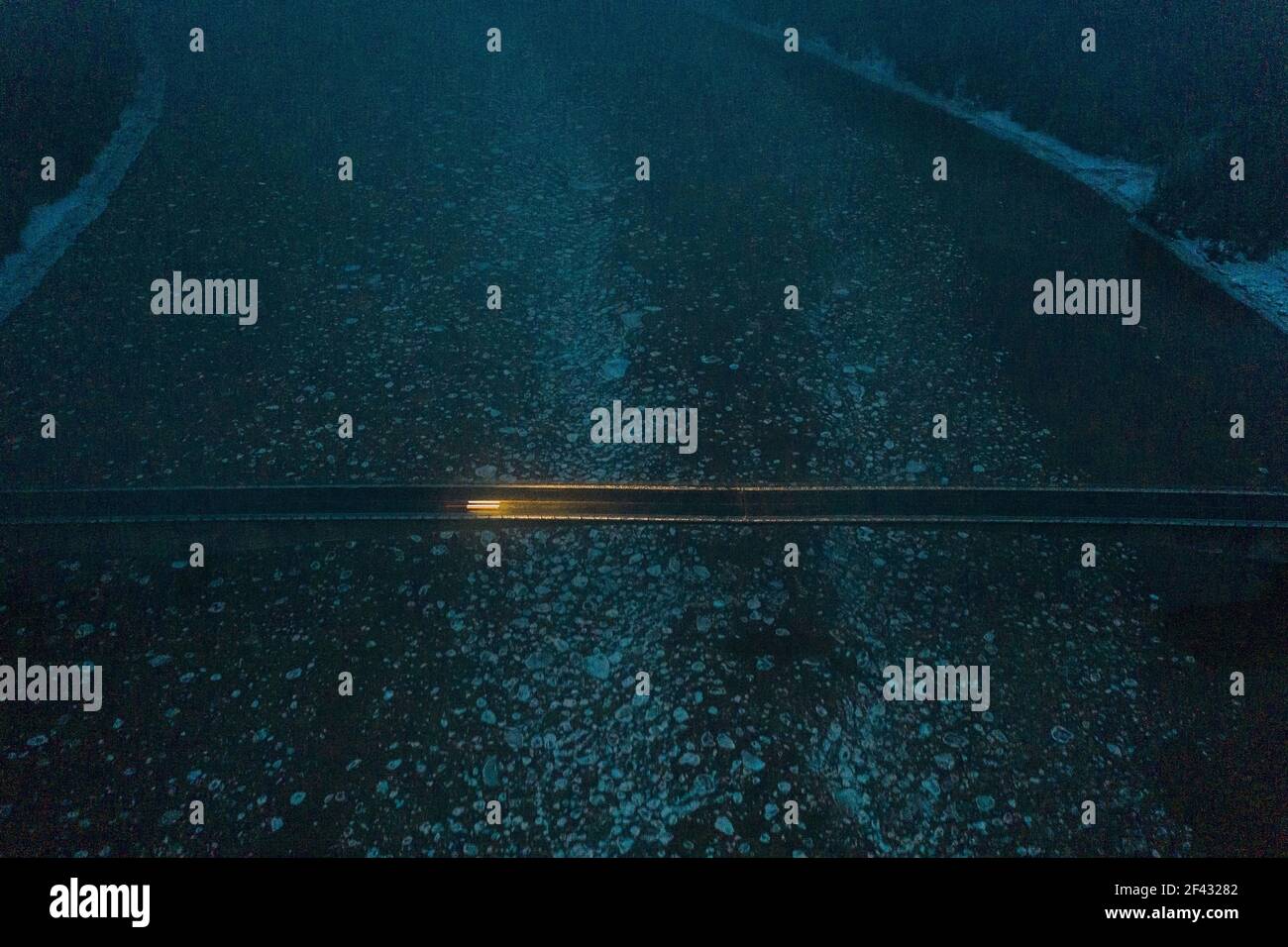 Aerial over Bridge and Ice Filled River Stock Photo - Alamy