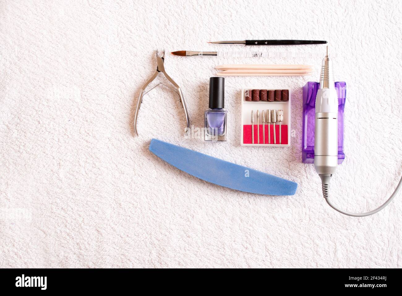 A top view of manicure and pedicure tools on a white table Stock Photo ...
