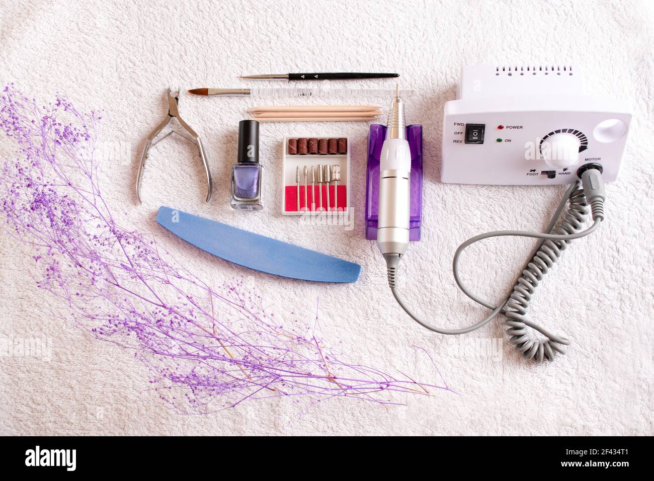 A top view of manicure and pedicure tools on a white table Stock Photo ...