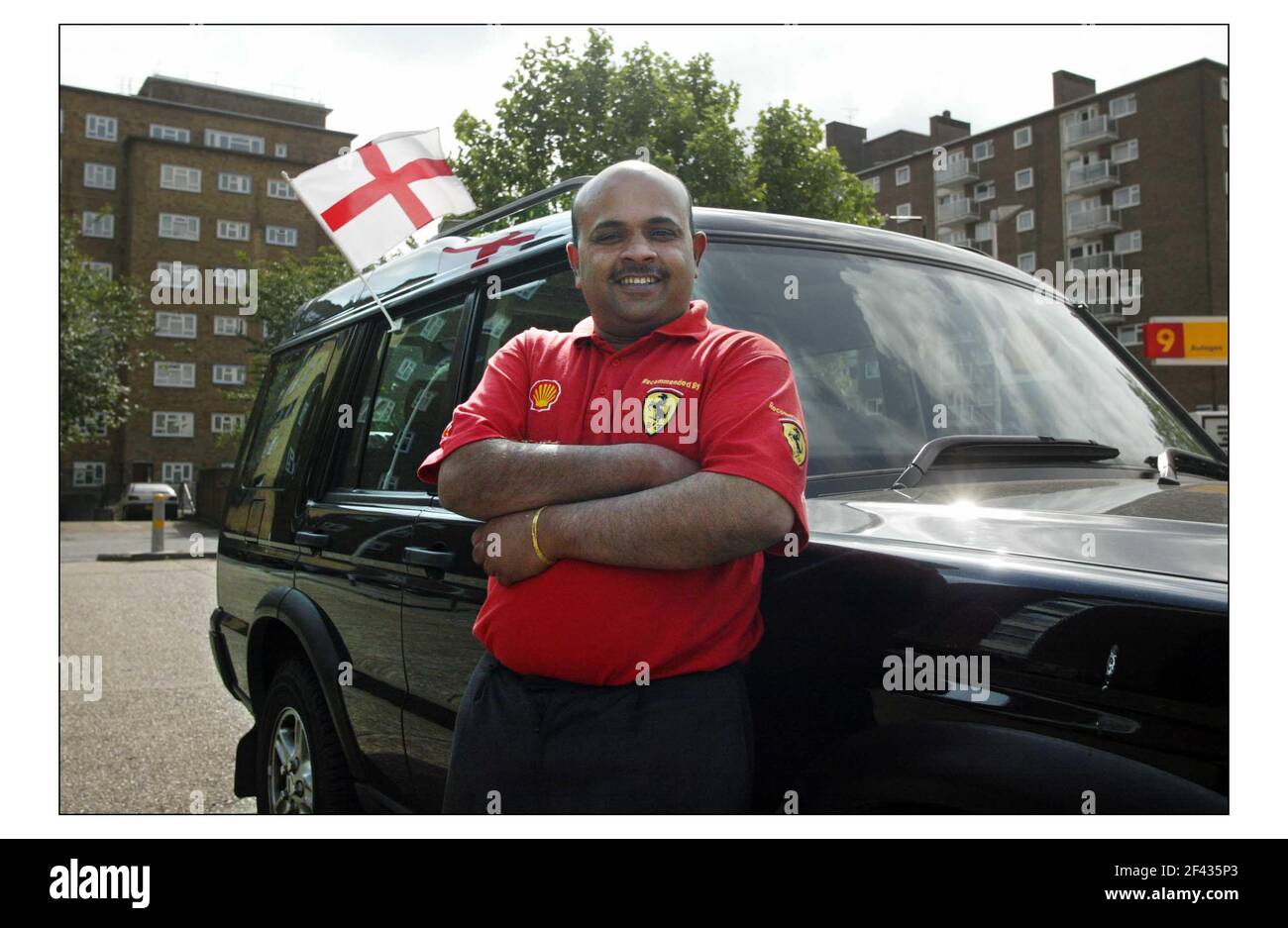 Ganga Mahaevan proud with his St. George flag.pic David Sandison 9/6 ...