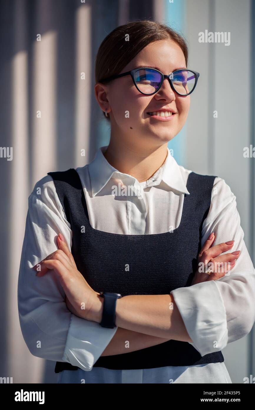 Confident business woman boss standing in modern office wearing glasses ...