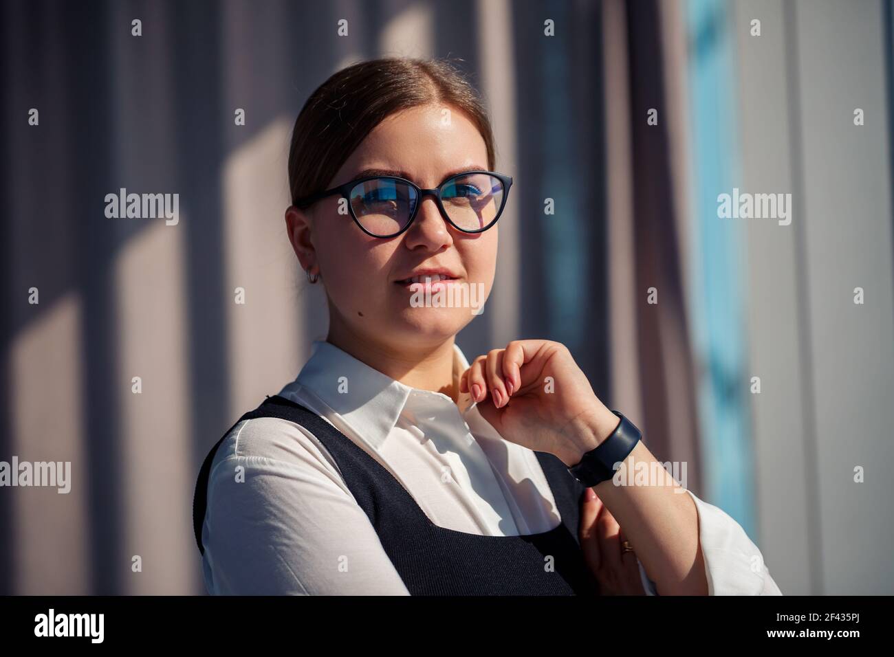 Confident business woman boss standing in modern office wearing glasses ...