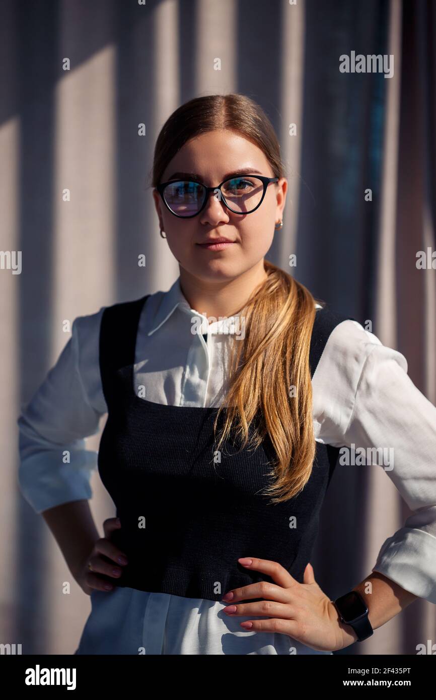 Confident business woman boss standing in modern office wearing glasses ...