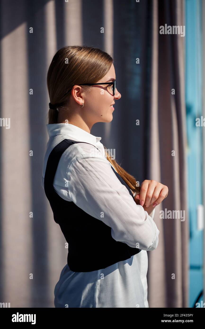 Confident business woman boss standing in modern office wearing glasses ...