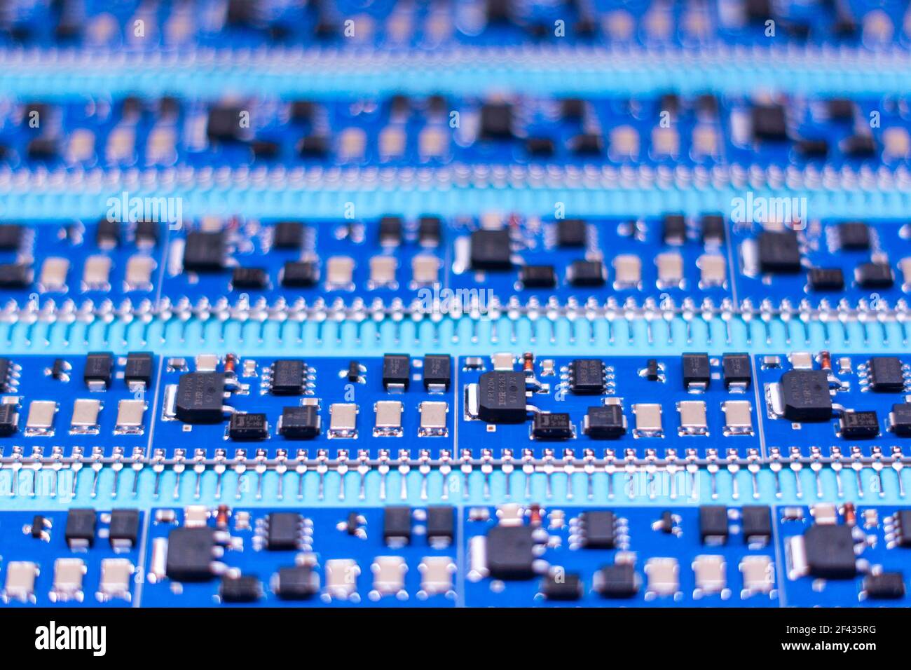 lots of electronic hybrid circuits with blue background Stock Photo - Alamy