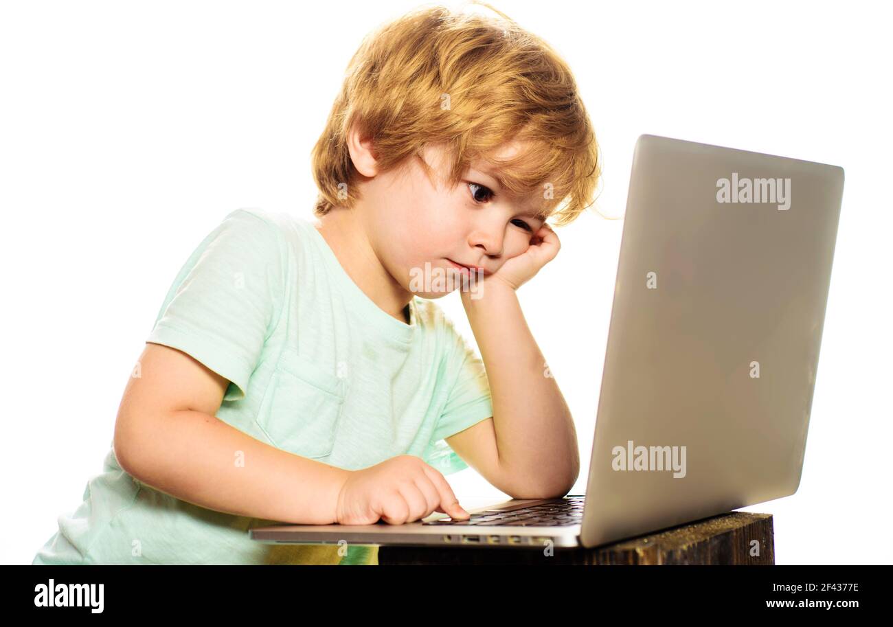 Learning. Child boy work with laptop. Homework. Lessons. School ...