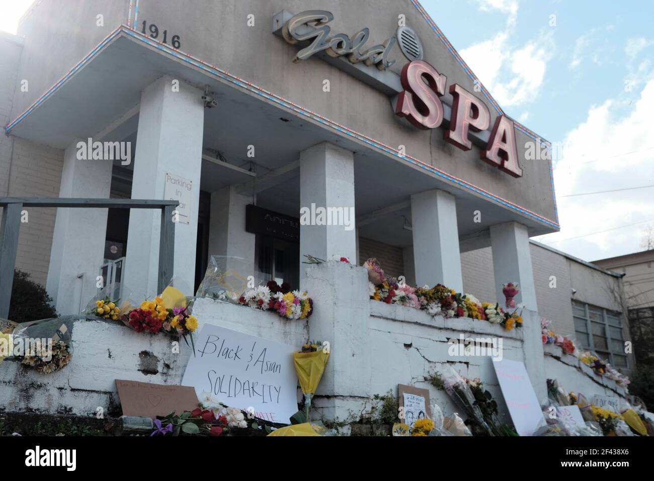 Atlanta, Georgia, USA. 18th Mar, 2021. A memorial with flowers and ...