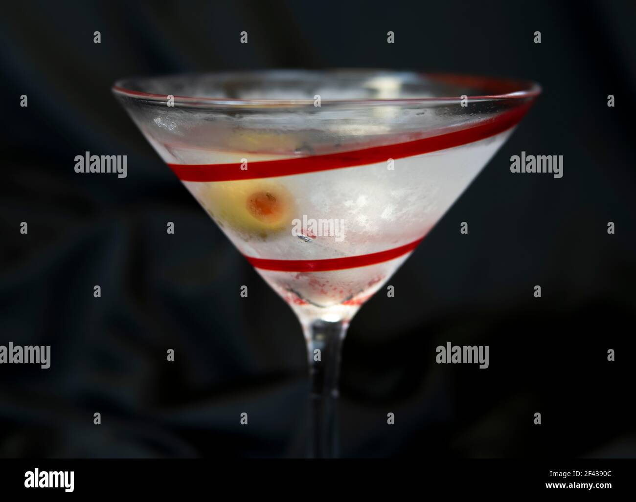A soft focus martini, ice cold with a single olive Stock Photo - Alamy