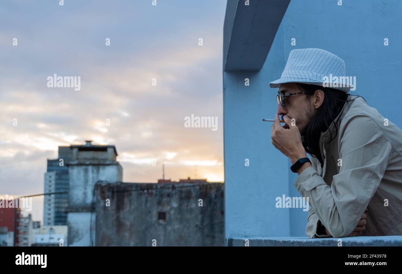 Cigarette smoke balcony hi-res stock photography and images - Alamy