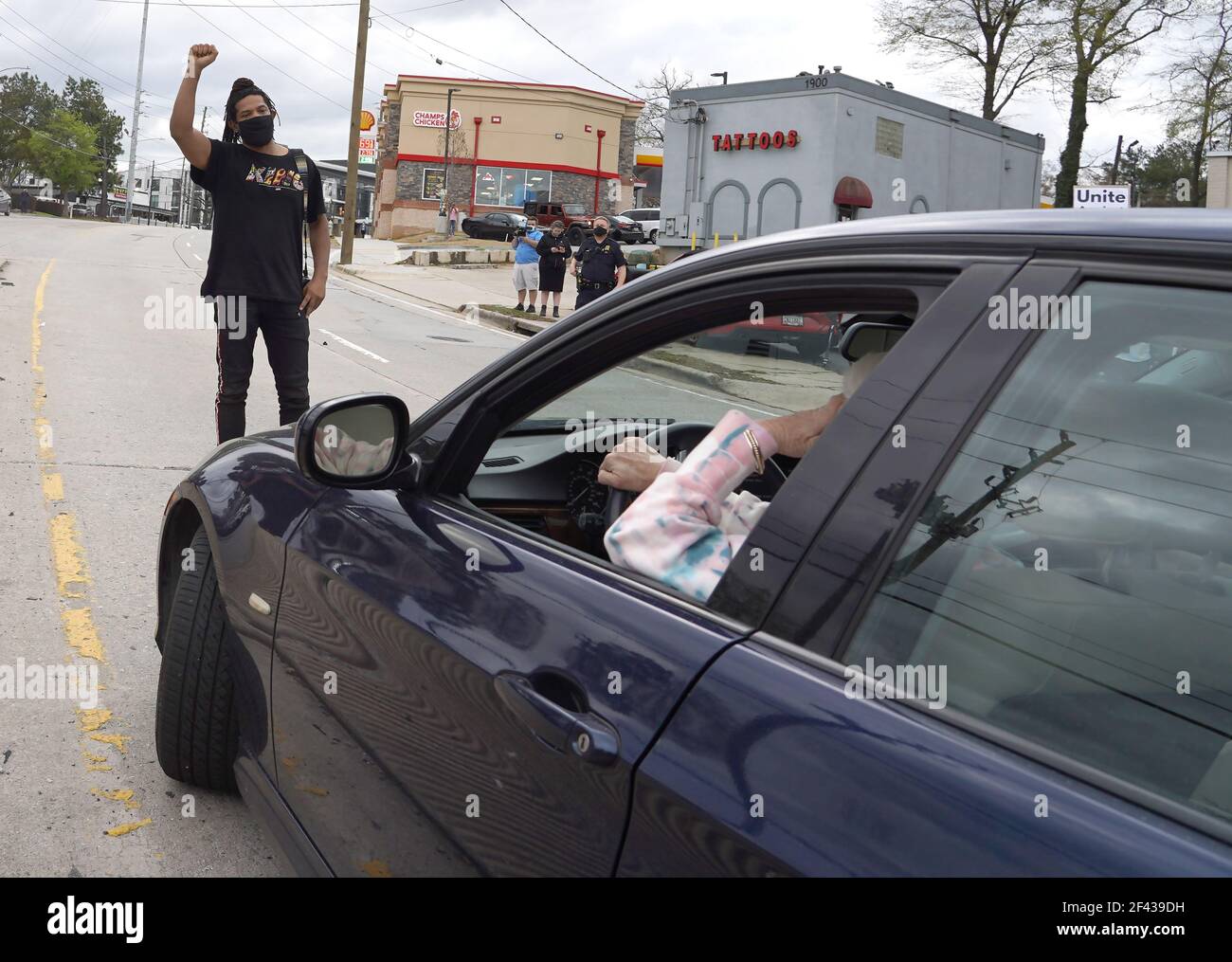Atlanta, United States. 18th Mar, 2021. Protestor Malik Peay blocks ...