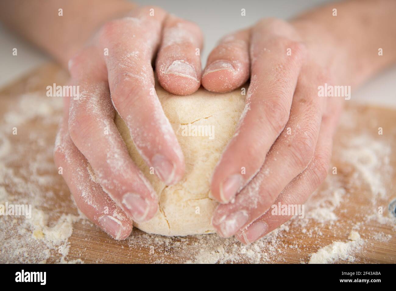 hands kneading and shaping dough Stock Photo - Alamy