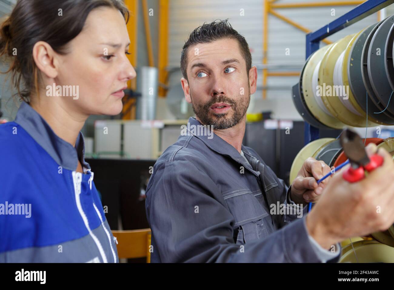two engineers are working together in factory Stock Photo - Alamy
