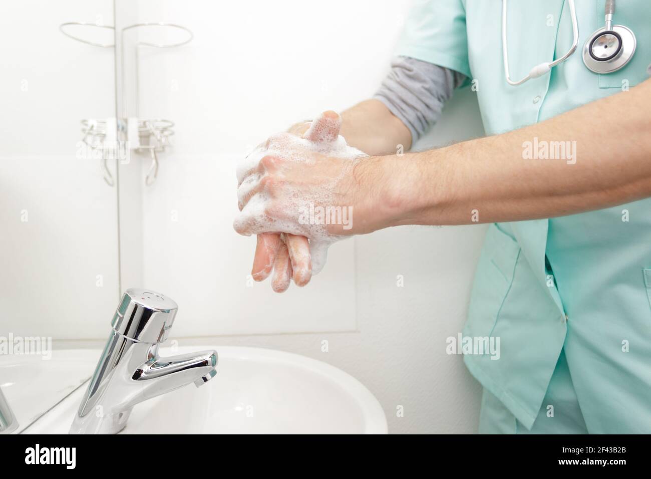 Doctor washing hands hi-res stock photography and images - Alamy