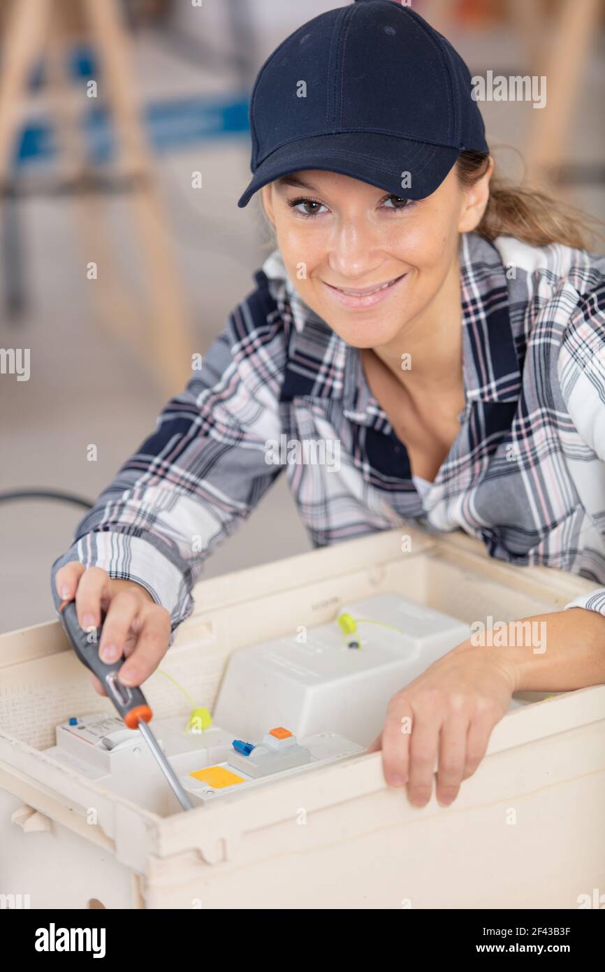 female electrician wiring a power inlet cabinet Stock Photo - Alamy