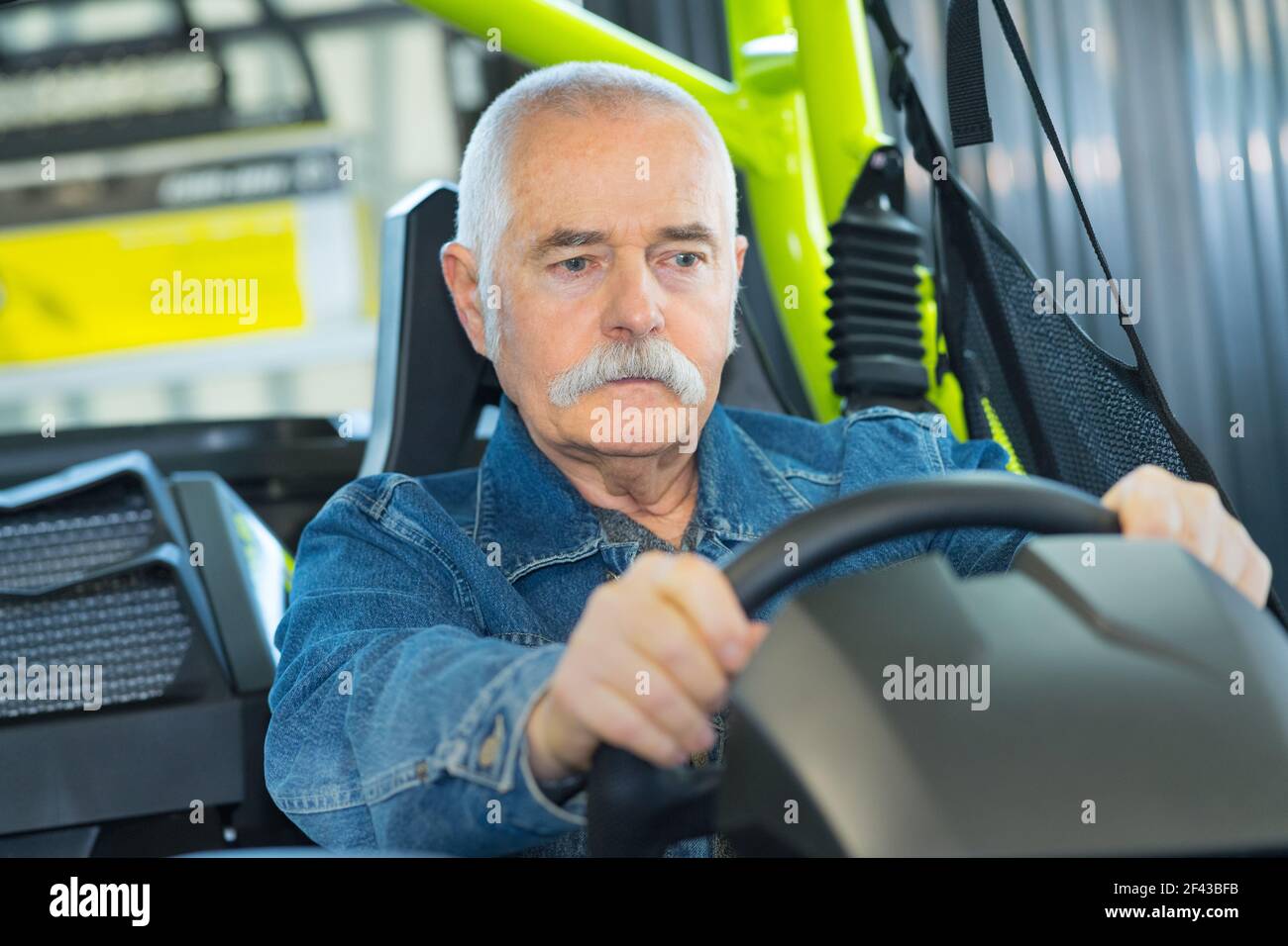 senior man at wheel of new buggy Stock Photo - Alamy
