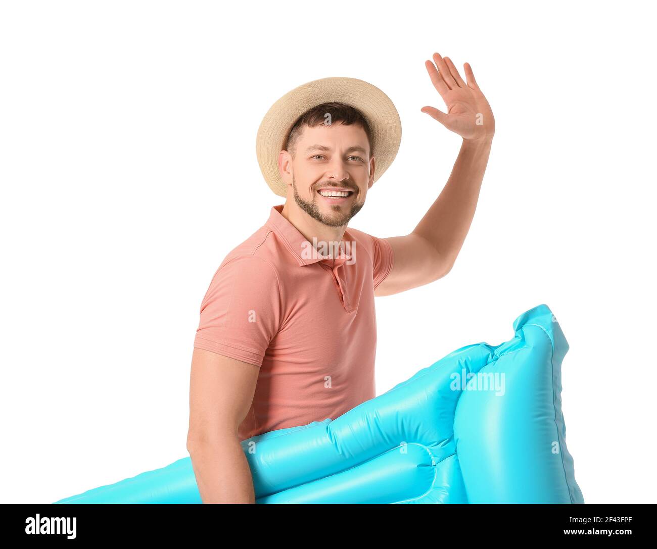 Handsome man with inflatable mattress on white background Stock Photo ...
