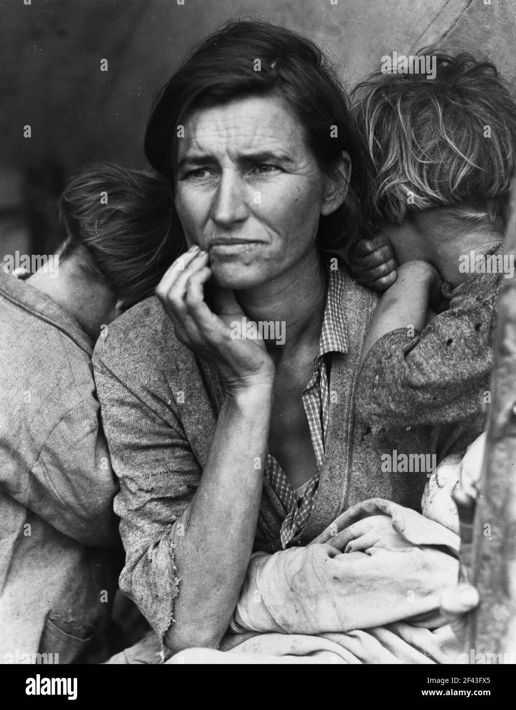 Migrant agricultural worker's family. Seven hungry children. Mother ...