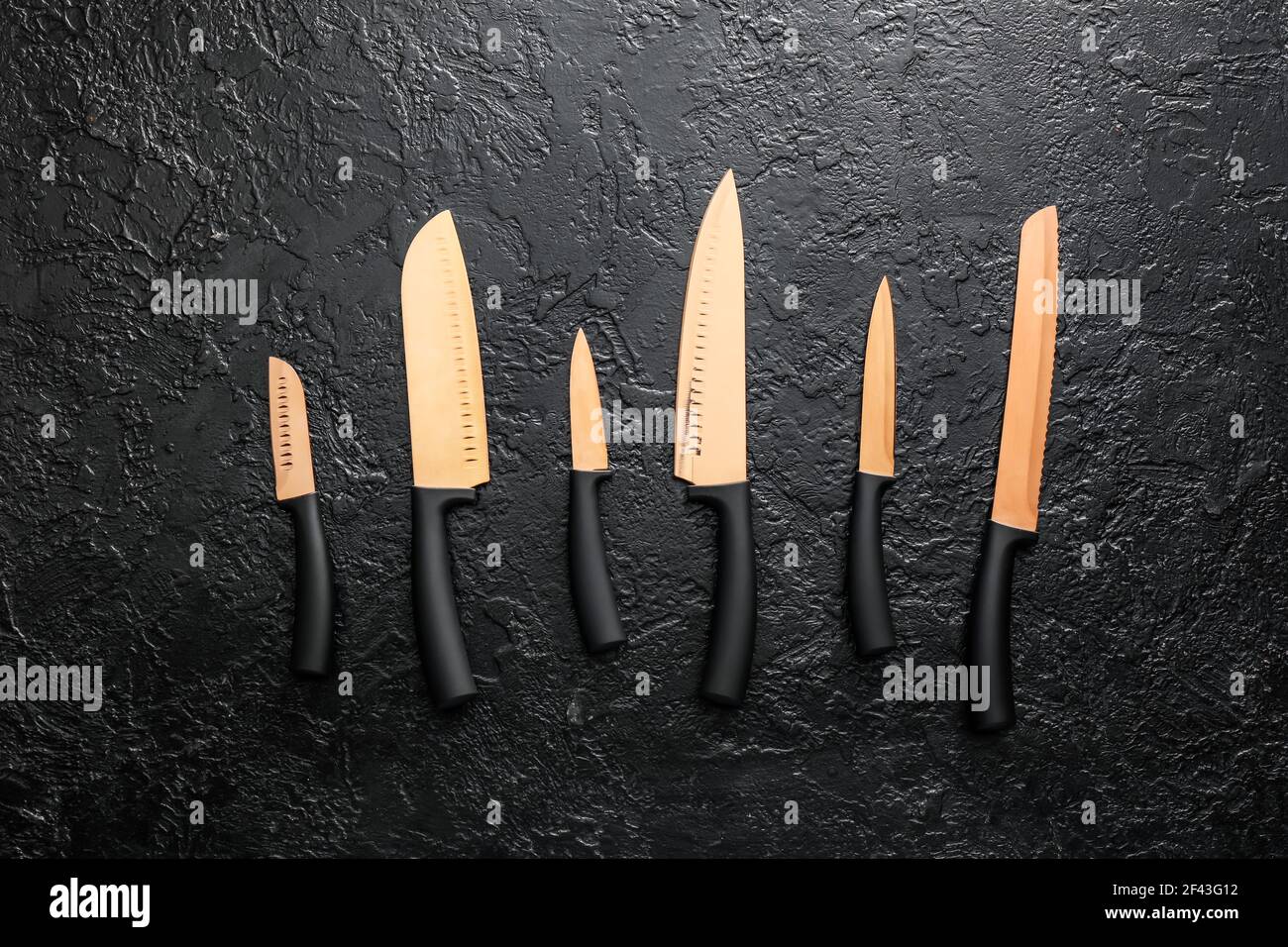 Set of knives on dark background Stock Photo - Alamy