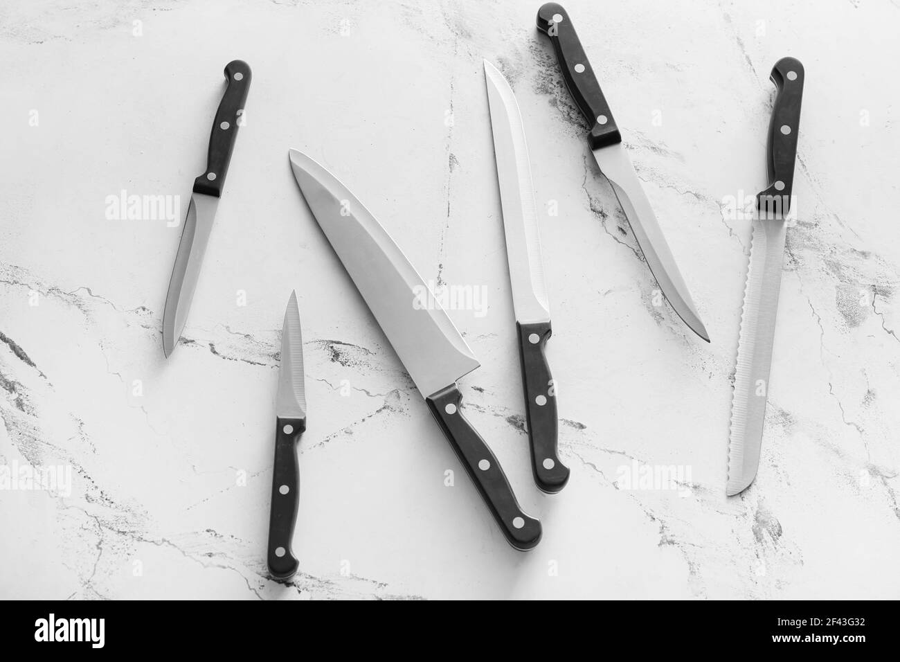 Set of knives on light background Stock Photo - Alamy