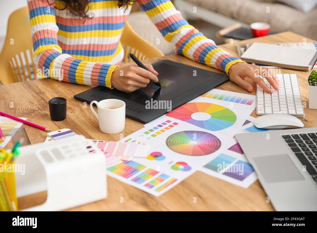 Graphic designer working in office Stock Photo - Alamy