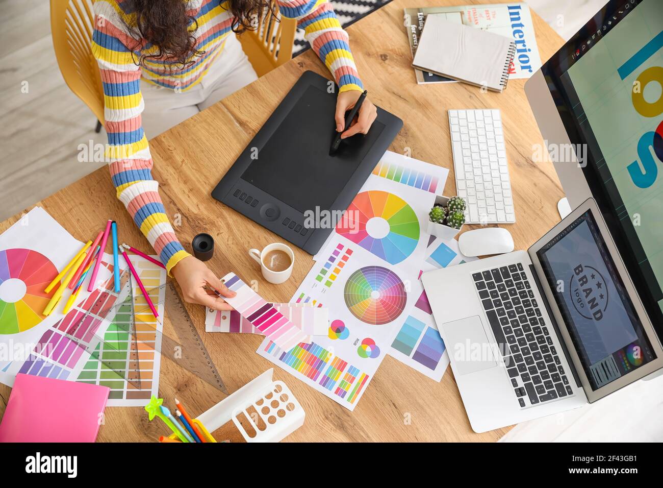 Graphic designer working in office Stock Photo - Alamy
