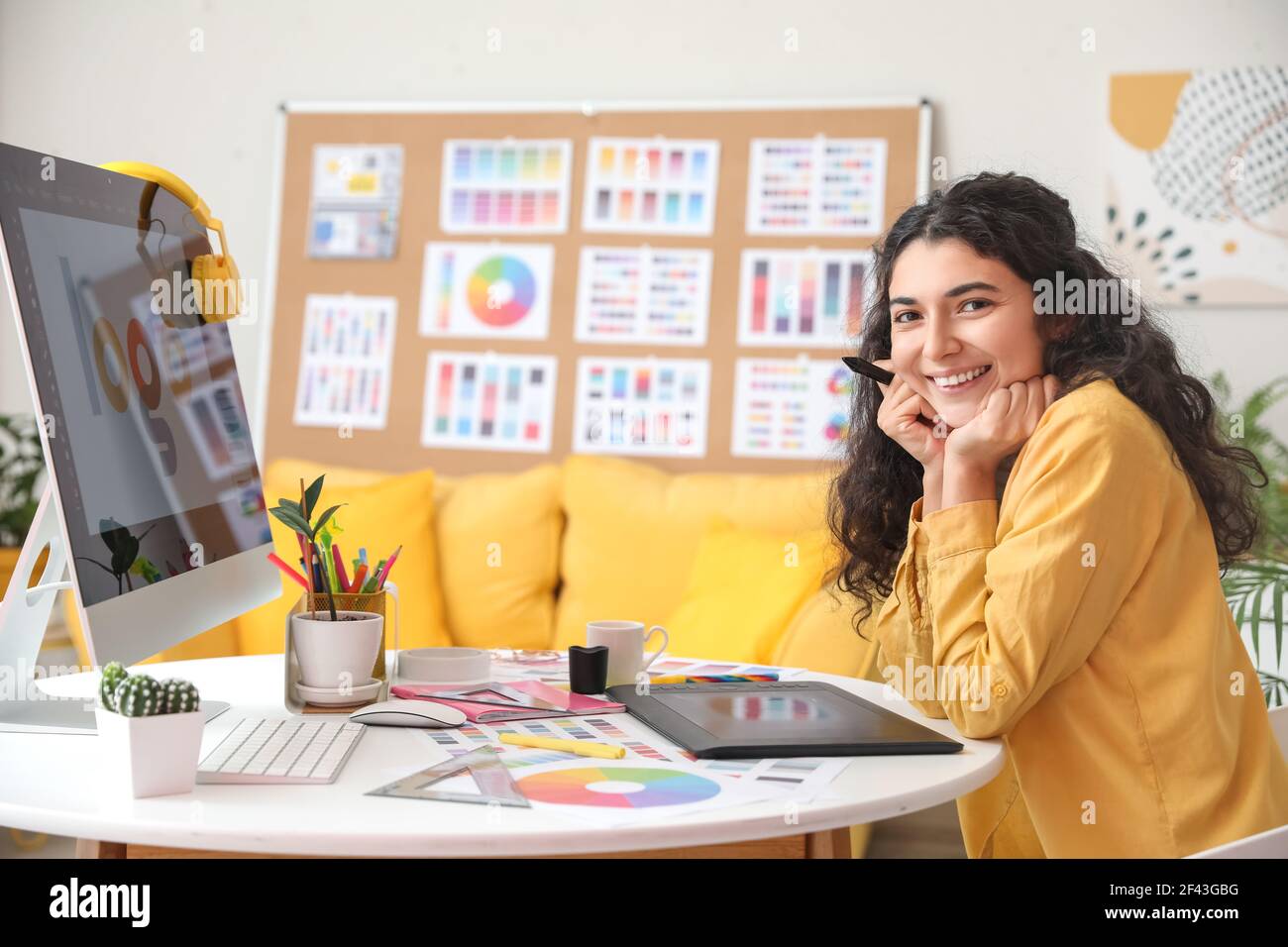 Graphic designer working in office Stock Photo - Alamy