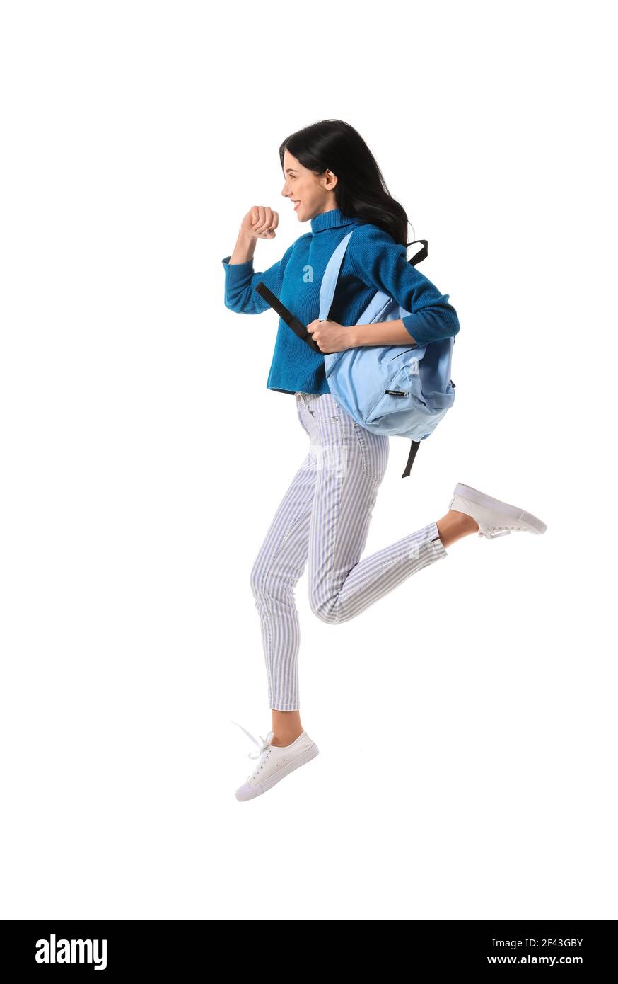 Jumping female student on white background Stock Photo - Alamy