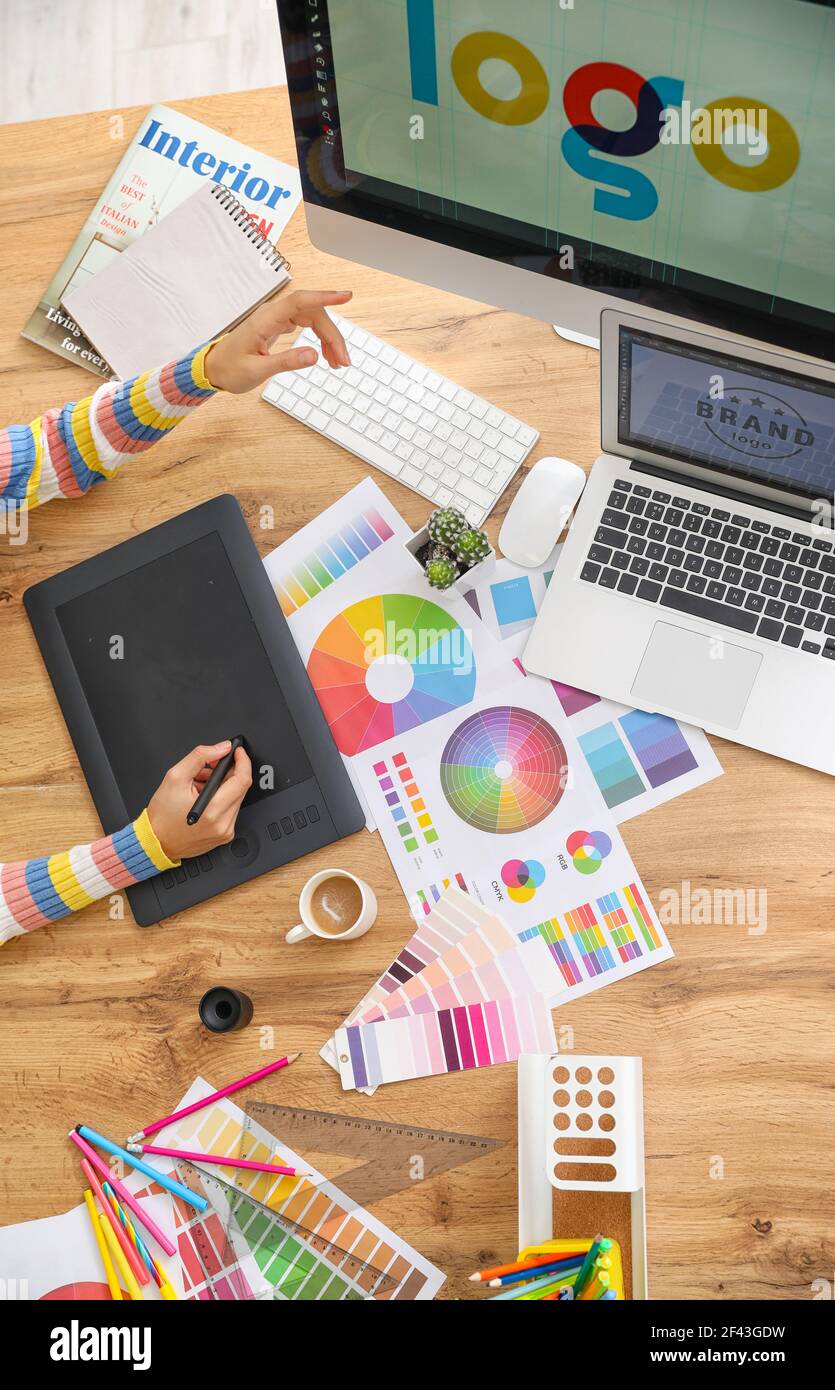 Graphic designer working in office Stock Photo - Alamy