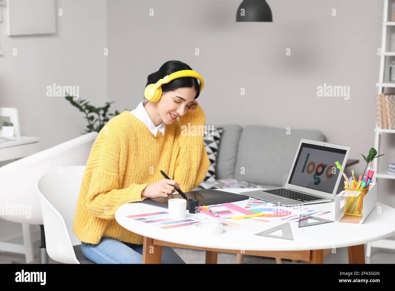 Graphic designer working in office Stock Photo - Alamy