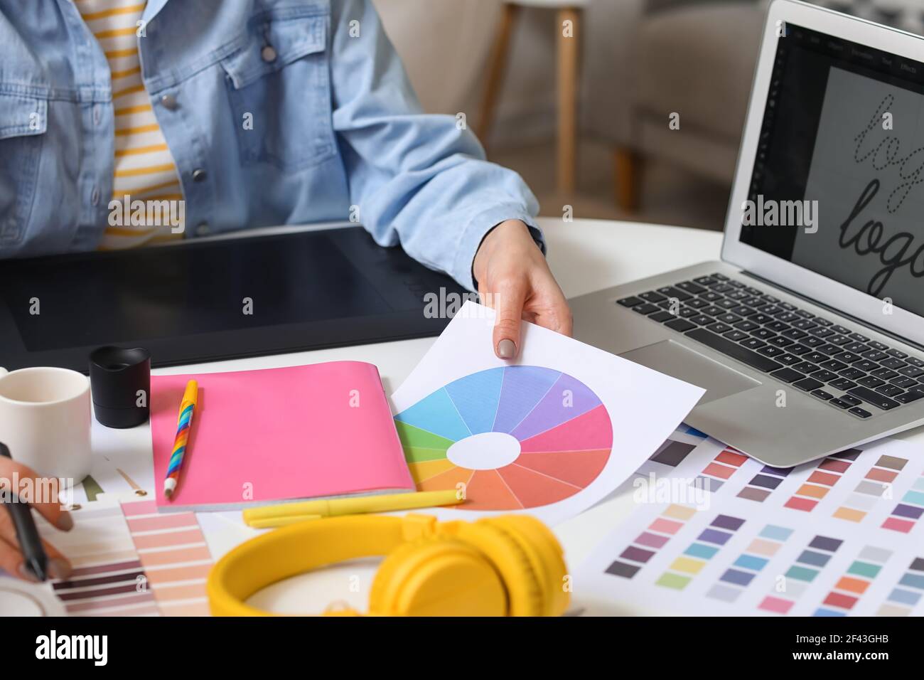 Graphic designer working in office Stock Photo - Alamy