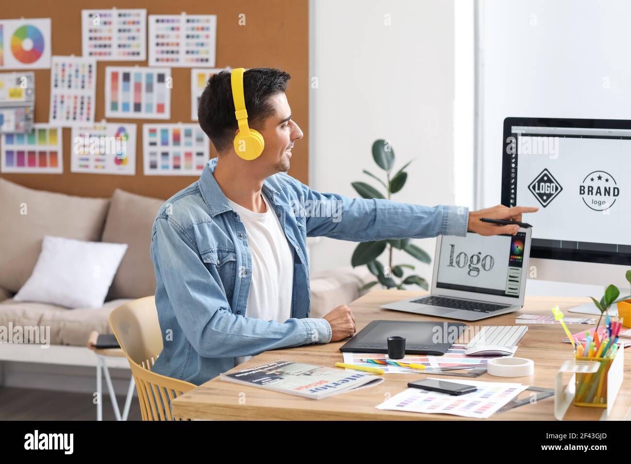 Graphic designer working in office Stock Photo - Alamy