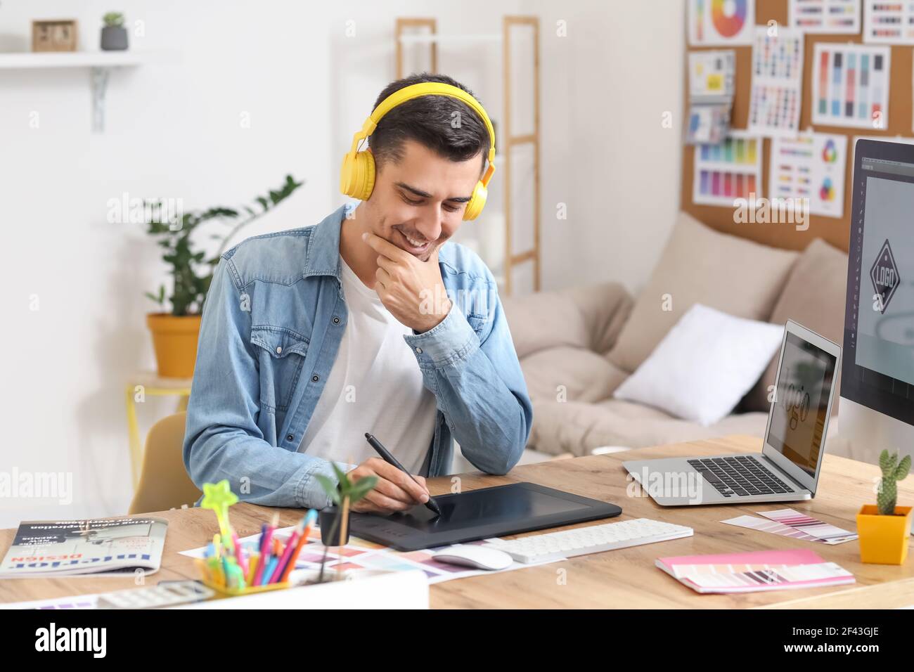 Graphic designer working in office Stock Photo - Alamy