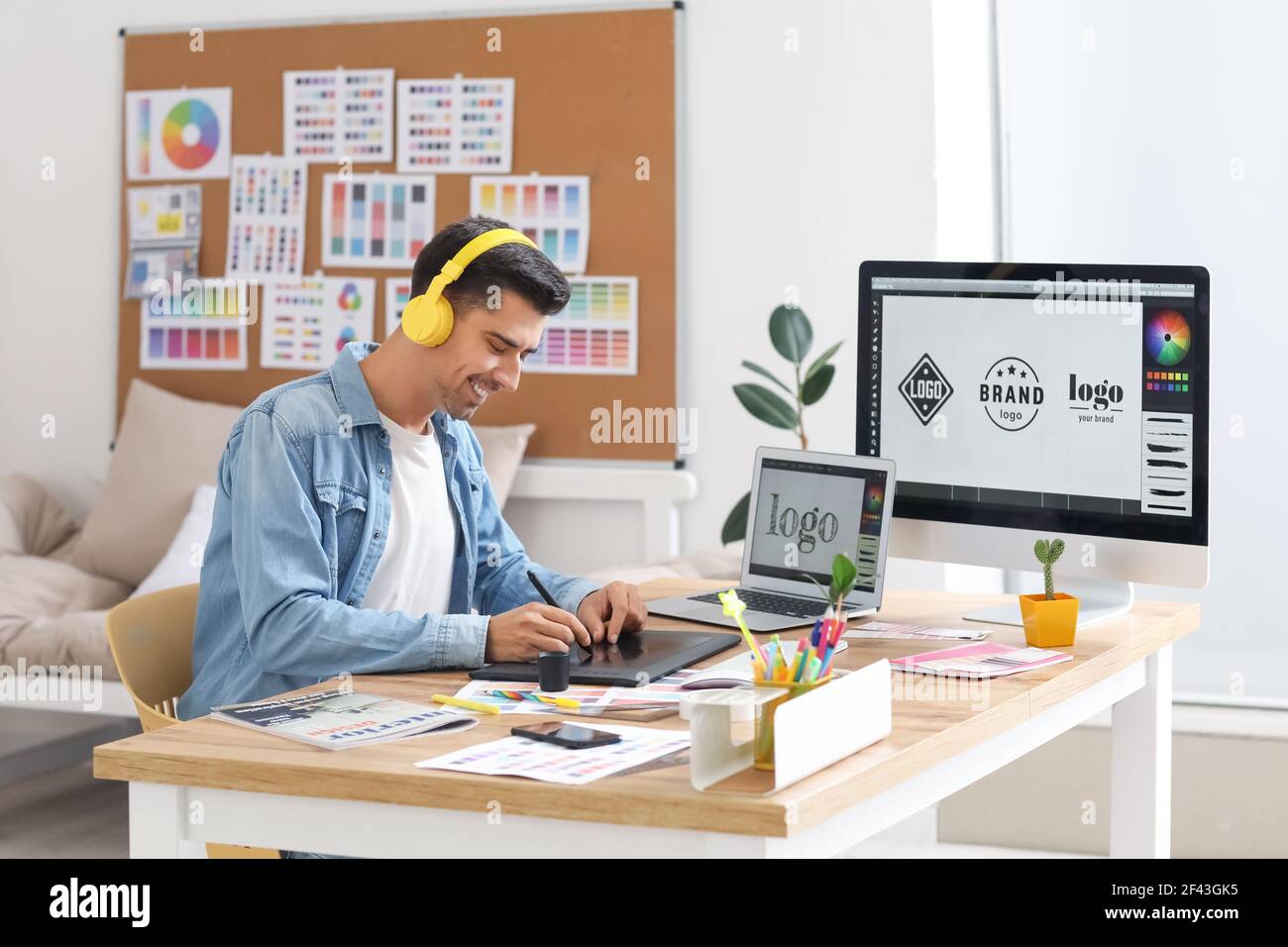 Graphic designer working in office Stock Photo - Alamy