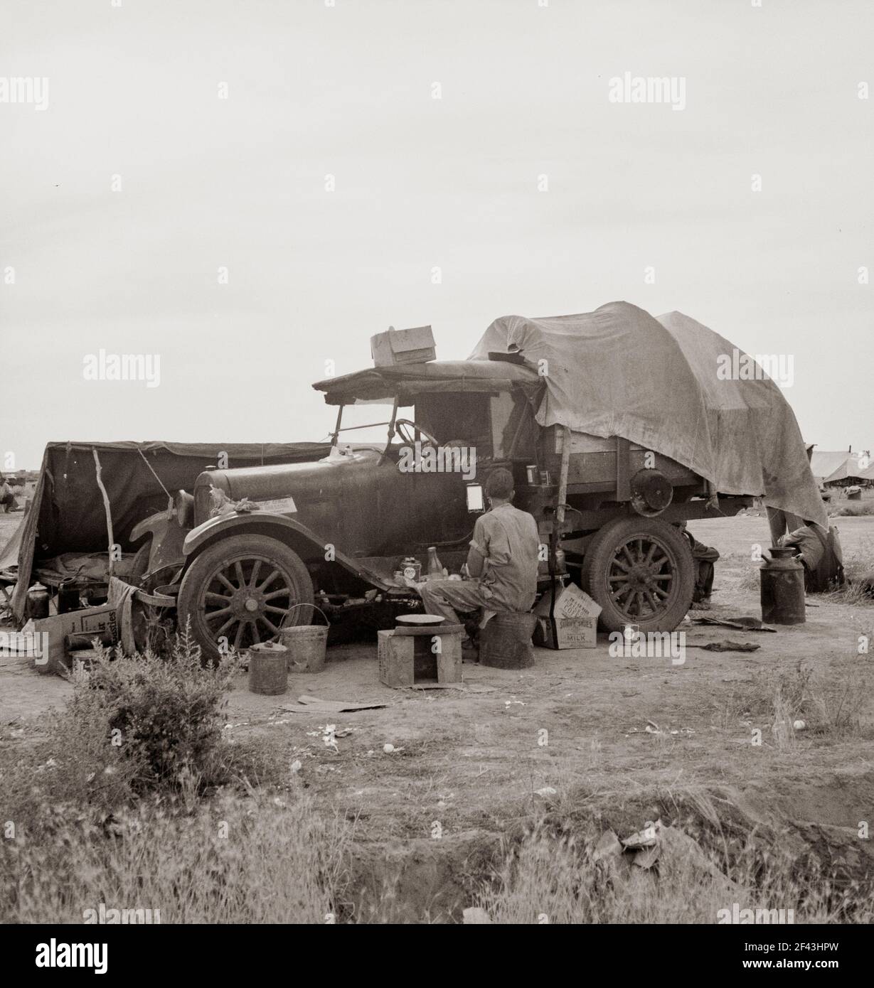 Potato picker in camp near Shafter, California. May 1937. Photograph by ...