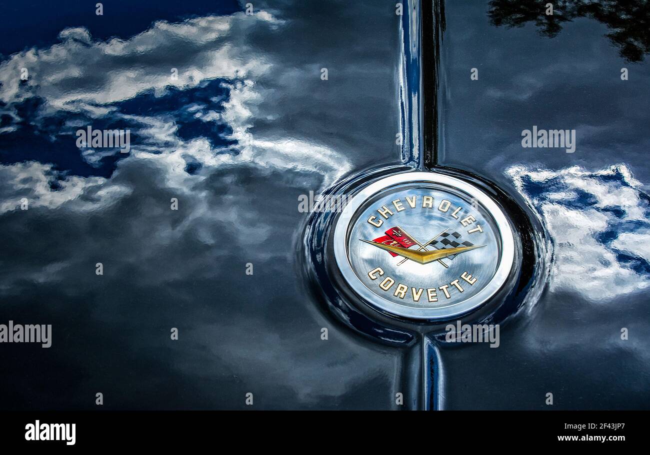 Chevrolet Corvette crossed flag emblem on blue vehicle with cloud ...