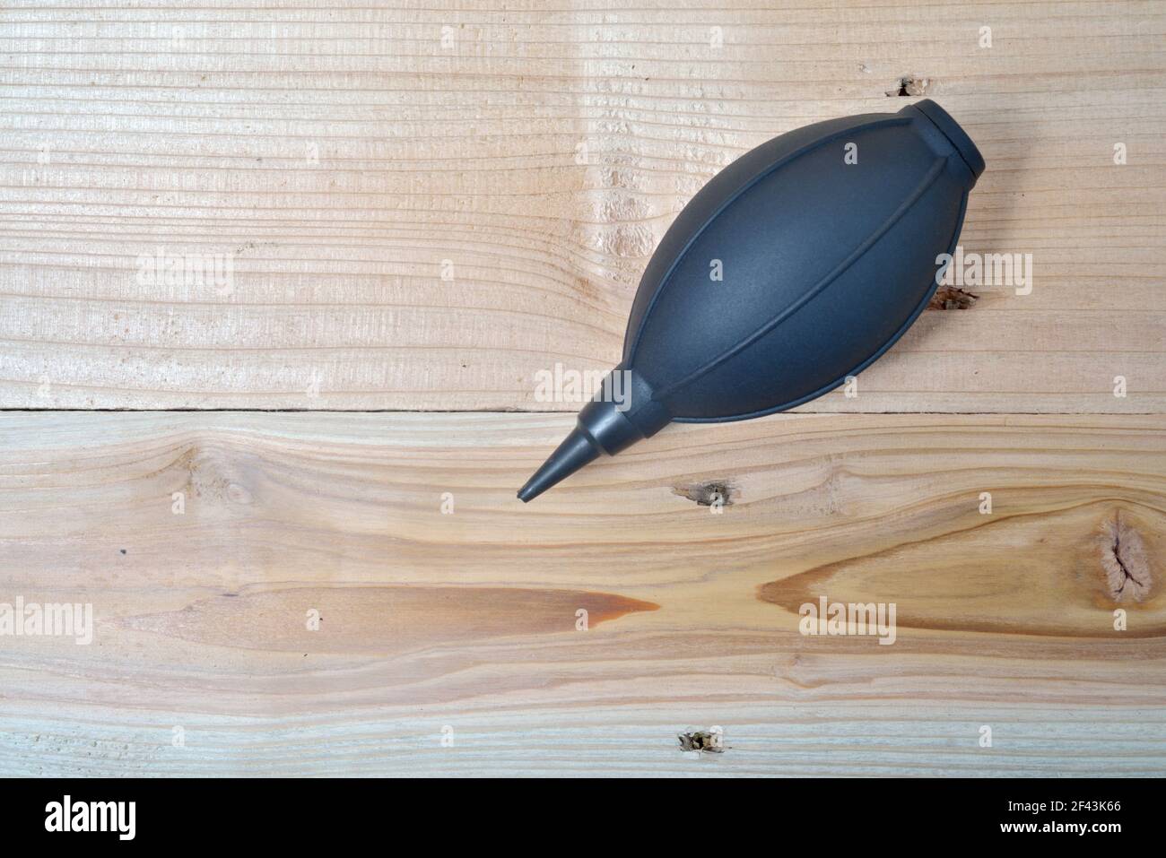 black blower - used for cleaning camera sensor - isolated on wooden ...