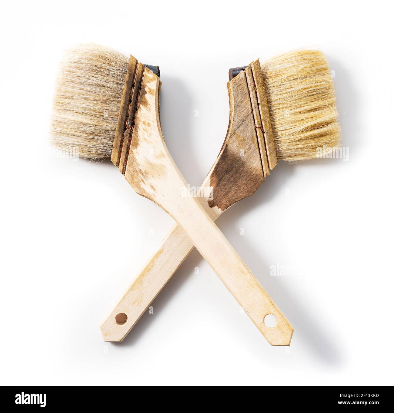 Brush used to apply oil stain to a white background Stock Photo - Alamy