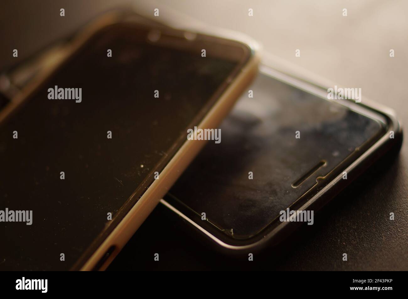 Two used large black cell phones. Protective lcd, with signs of use ...