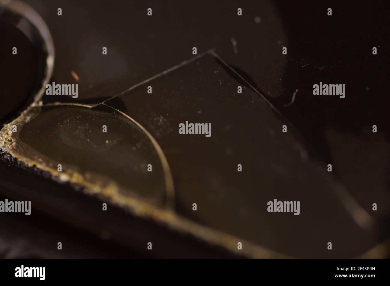 Smartphone protective glass - damaged, cracked, worn out. Old screen ...