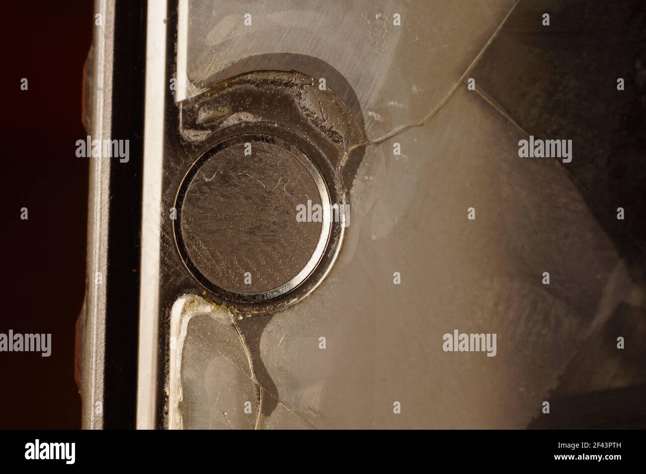 Smartphone protective glass - damaged, cracked, worn out. Old screen ...