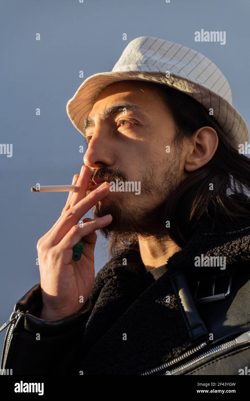Cowboy smoking cigarette hi-res stock photography and images - Alamy