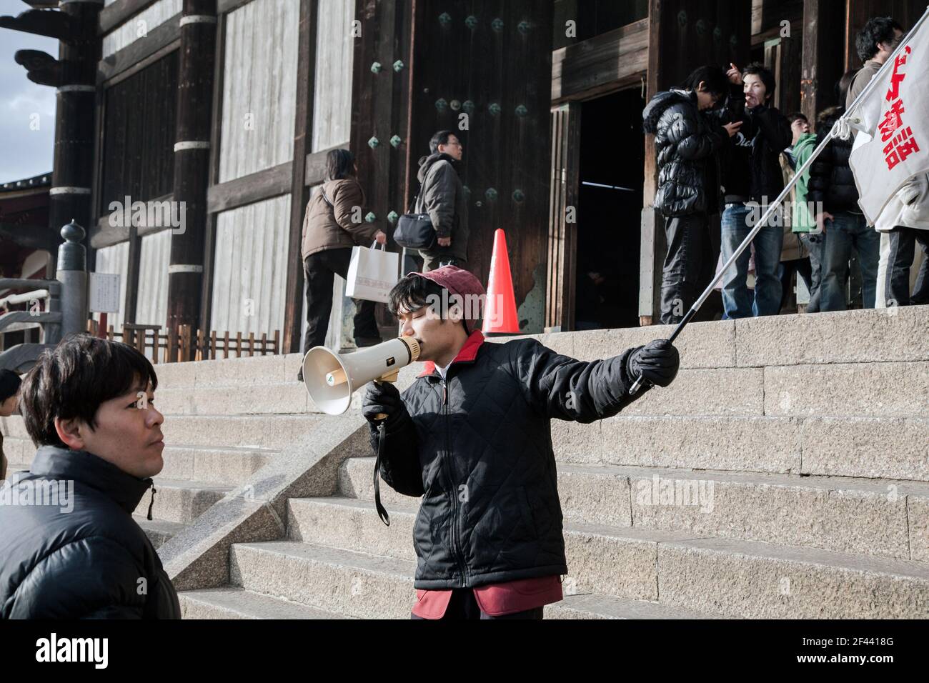 Japanese guide using megaphone outside Great Buddha Hall, Todaiji ...