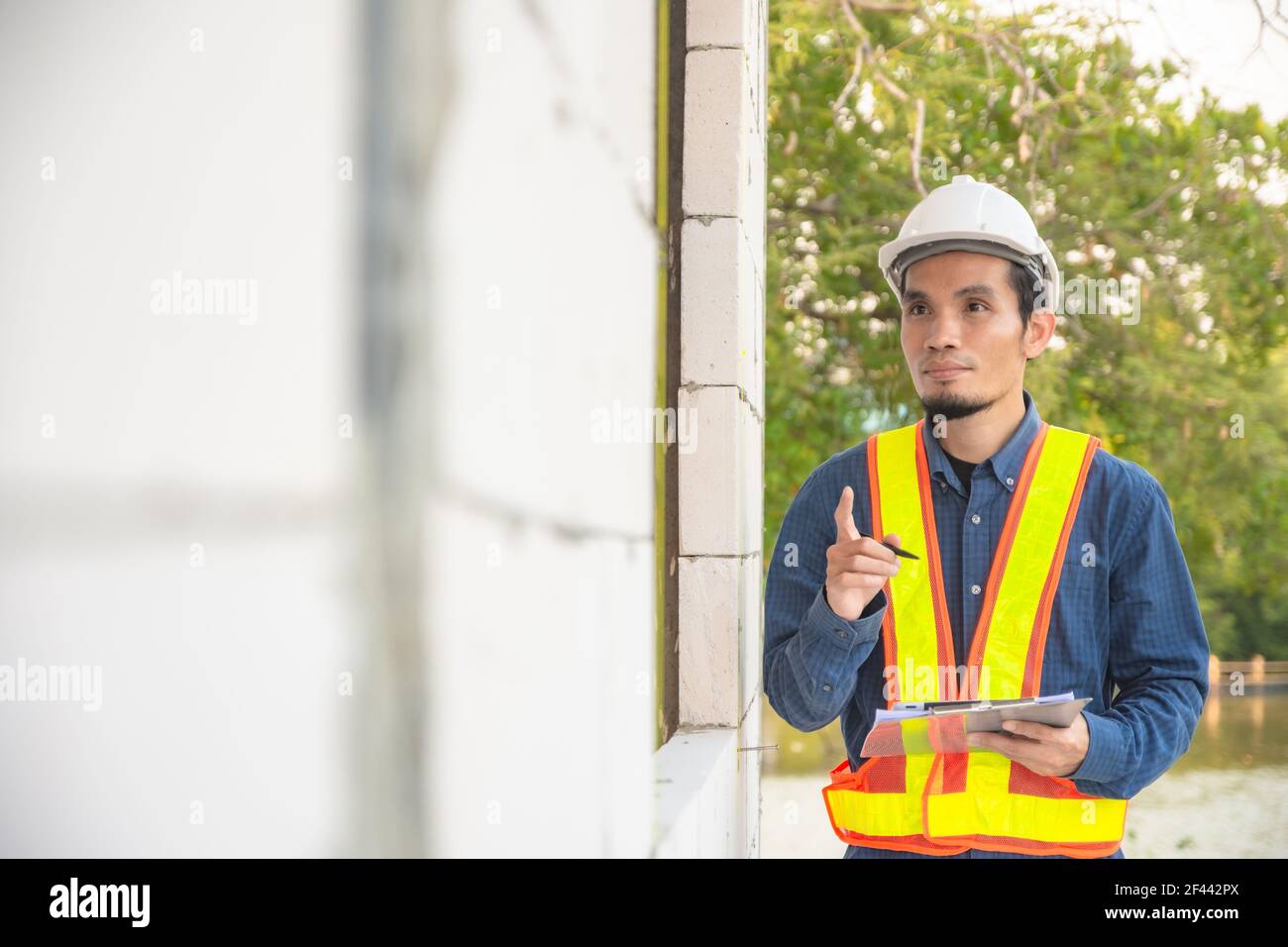 Foreman checking house in construction site by tablet technology Stock ...