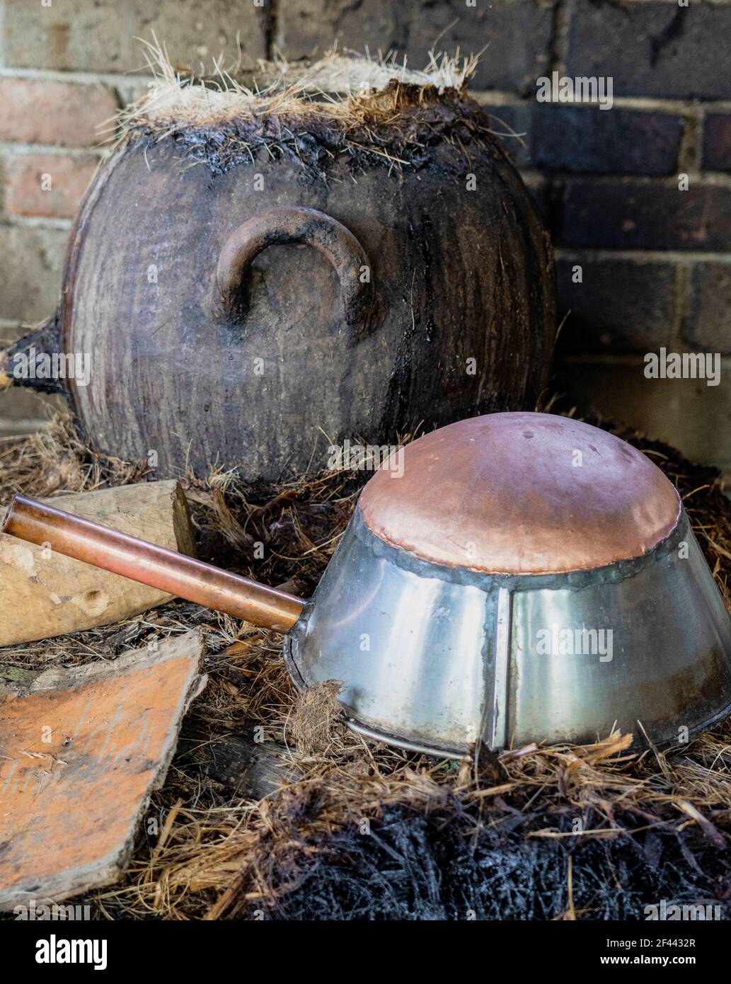 A copper bottom pot is used for condensation in the distillation of ...