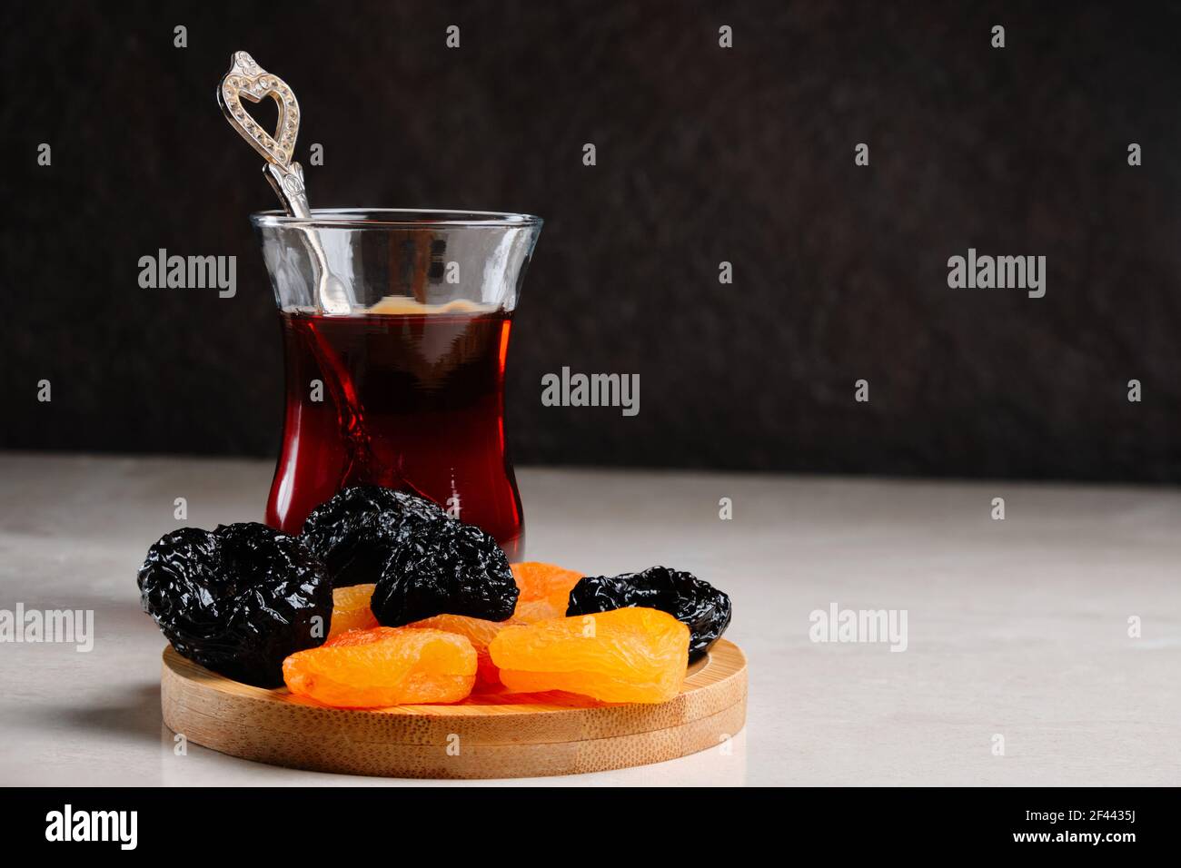 Turkish tea and dry fruits at table Stock Photo - Alamy